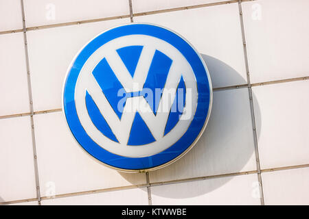 Volkswagen VW sign on a store facade. Volkswagen is a famous European ...