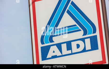 Aldi sign (north division) against blue sky. Aldi is a leading global ...