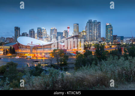 View of the Saddledome and Downtown skyline from Scottsman Hill at dusk ...