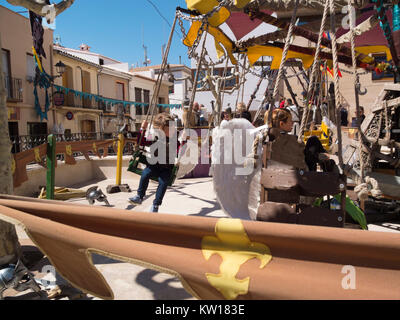 medieval childrens carousel during mediaval festival in Lliber village ...