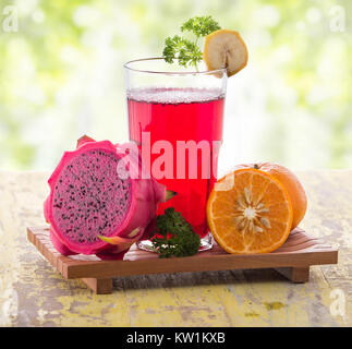 Red Dragon fruit and Orange Smoothie Stock Photo - Alamy