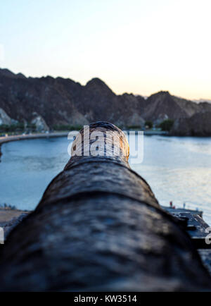 Oman, Muscat: an old watchtower overlooking the buildings of Old Muscat ...