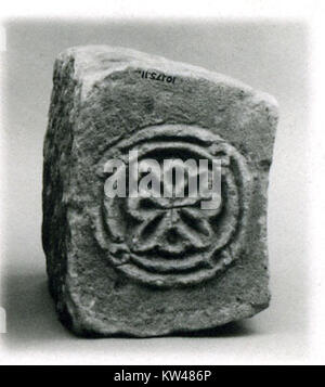 This fragment, featuring relief decoration, is part of a larger piece ...