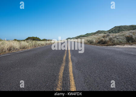 Extreme Low Angle of Road with Grasses over sand dunes Stock Photo - Alamy