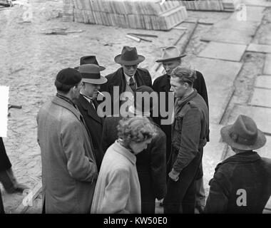 This image captures a moment of discussion between Governor Albert C ...