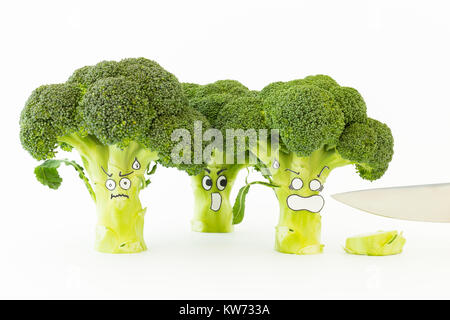 Closeup of fresh green broccoli with scared cartoon style face on white ...