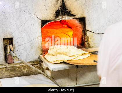 Baking traditional arabic flatbread at a bakery in Dubai's Old Town ...