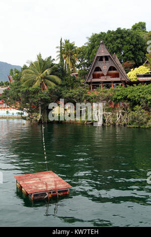 House and palm tree on the Samosir island Stock Photo - Alamy