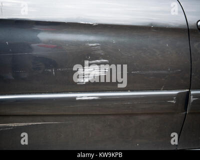 Scratches on the rear wing of a black car Stock Photo - Alamy