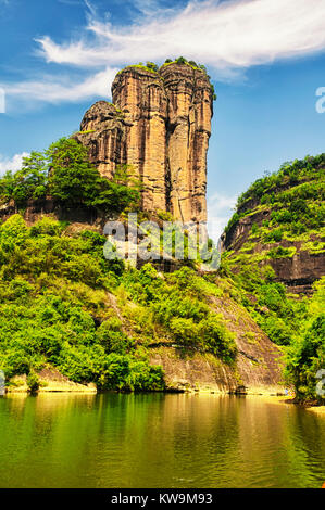 Rock formations lining the nine bend river or Jiuxi in Wuyishan or ...