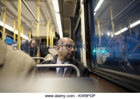 A man looking out of a bus window Stock Photo - Alamy