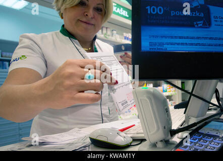 Pharmacist in pharmacy scans a prescription Stock Photo - Alamy