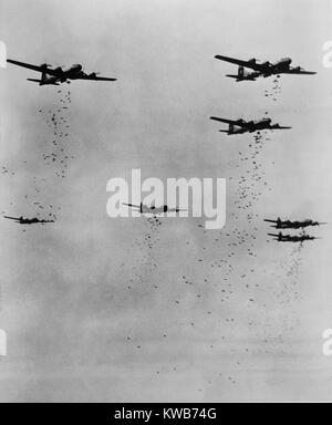 Formation of B-29's releasing incendiary bombs over Japan in June 1945 ...