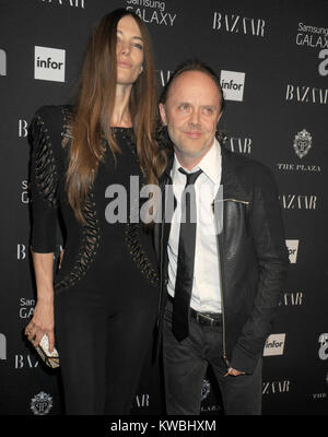 Jessica Miller and Lars Ulrich attending the 59th Grammy Awards in Los ...