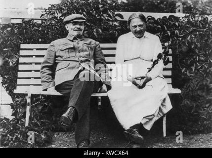 Lenin and his wife Krupskaya sit together in their dacha garden at ...