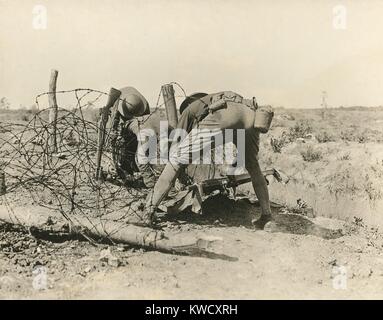 IN THE WIRE, a body of an American soldier caught on barbed wire fence ...
