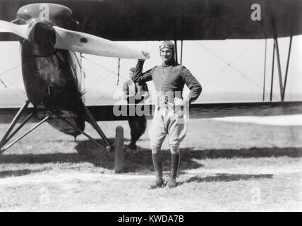 Brigadier General Billy Mitchell, in aviator's clothes, standing beside ...
