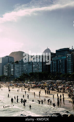 Crowd of people at Leme and Copacabana beach. General view of ...