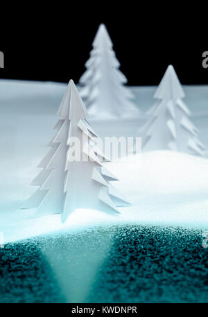 Three paper origami christmas trees on blue background, flat lay Stock ...