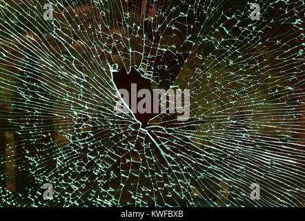 A shattered safety glass window makes interesting patterns Stock Photo ...
