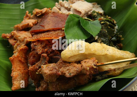 Nasi Campur Babi Guling. Balinese rice dish of steamed rice topped with ...
