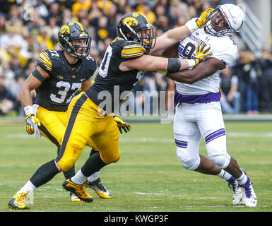Iowa defensive end Parker Hesse (40) tackles Northern Iowa quarterback ...