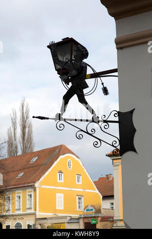 Wrought iron sign on an old wall Stock Photo - Alamy