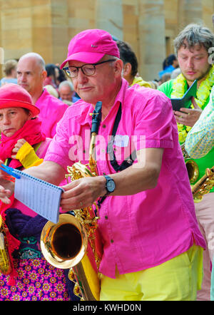Man playing baritone saxophone in jazz style, front view Stock Photo ...
