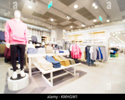 Abstract blur clothing boutique display interior of shopping mall ...