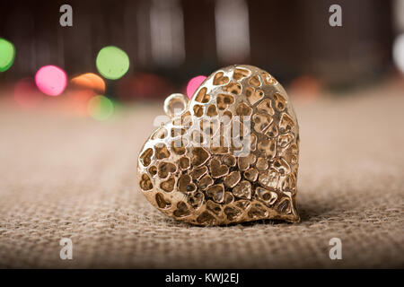 Christmas lights behind heart shaped object Stock Photo - Alamy