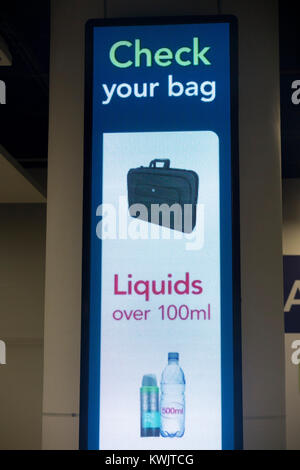 Warning sign regarding the rules on carrying no more than 100 ml of ...