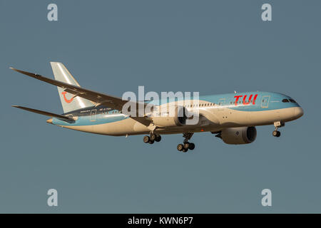 TUI Airways Boeing 787-8 Dreamliner at Manchester Airport as a family ...