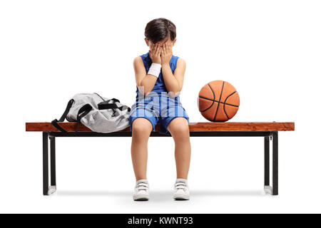 Sad disappointed boy with basketball ball in a physical education ...