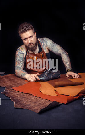 Leather Professional works with leatherwork in the place of work Stock ...