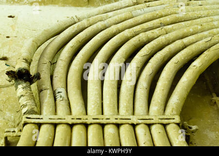 Old electrical wiring and copper pipe under the floorboards of a 1930 ...