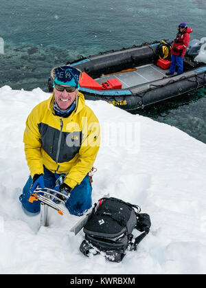 Doug Stoup; owner of Ice Axe Expeditions; helps to load large ...