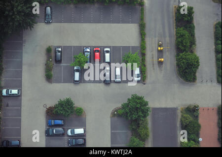 Car parking space from above with a parked white car with shadows ...