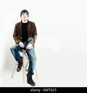 Man, hat or thinking at studio background with fashion, theater ...