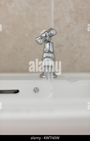 A broken bathroom tap Stock Photo - Alamy