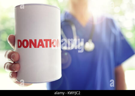 Doctor with gift box in the hospital Stock Photo - Alamy