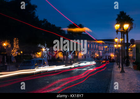 Intense traffic in Faro city near the marina at sunset Stock Photo - Alamy
