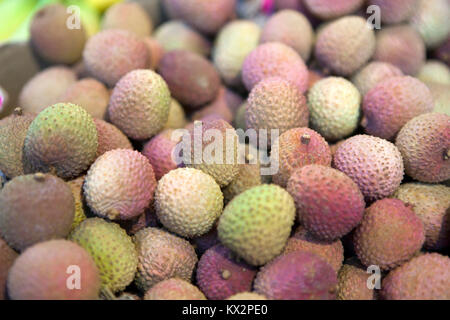 An abundance of lychees for sale on a market stall Stock Photo - Alamy