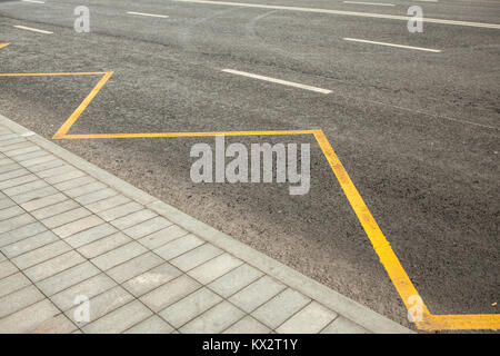 Road markings indicating no stopping or parking bus station Stock Photo ...