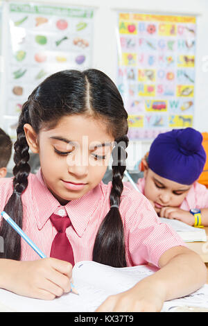 1 Indian School Kid Girl Student Writing Notebook Studying Classroom ...