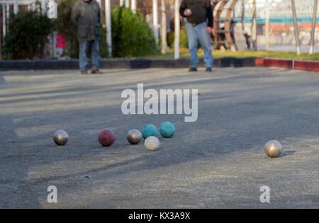 Game of jeu de boule, silver metal balls in sand. A french ball game ...
