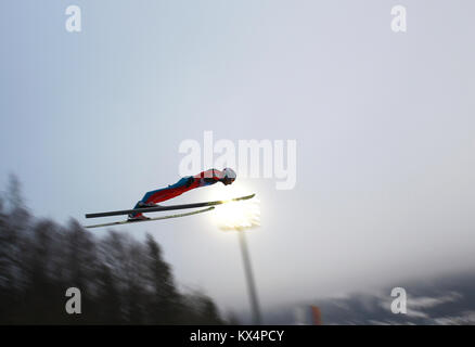 Killian Peier, of Switzerland, soars through the air during his first ...