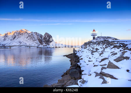 A lighthouse in Reine on Lofoten Islands by sunset, Norway Stock Photo ...
