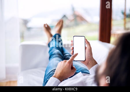 Mockup image of a hand using and touching laptop with blank white ...