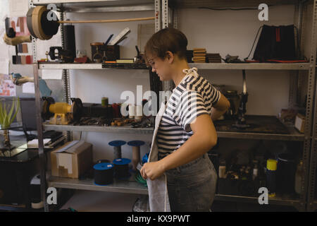 Female worker wearing apron Stock Photo - Alamy
