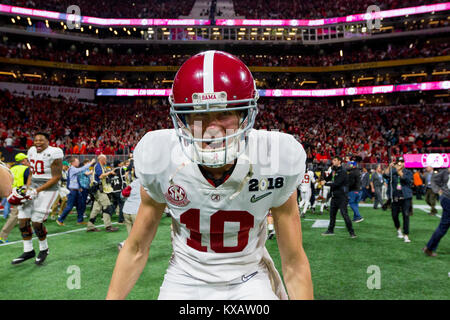 Alabama punter JK Scott (10) kicks the ball before an NCAA college ...